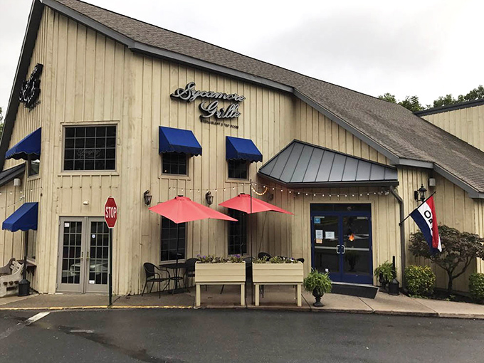 The inviting exterior complete with outdoor dining space &ndash; your gateway to discovering Delaware Water Gap's hidden gem.