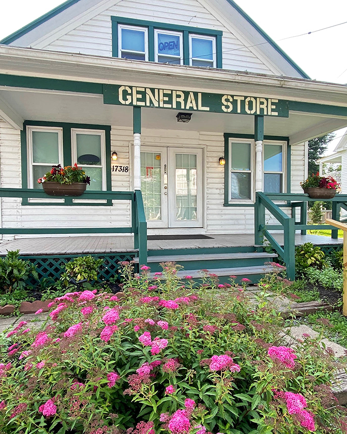 The front porch, framed by vibrant flowers, invites you to slow down. In a world of drive-thrus, this place asks you to stay awhile.