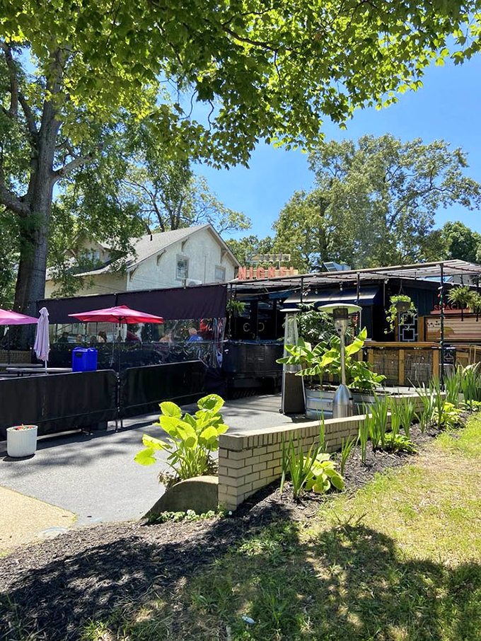 The exterior view reveals Little Nickel's clever use of space, creating an oasis of tropical dining in Richmond's urban landscape.