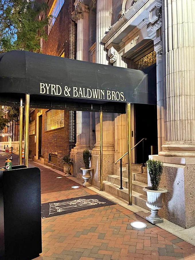 The elegant awning and classical columns create a grand entrance that sets expectations high. Those stone steps have welcomed countless celebration dinners and special occasions.