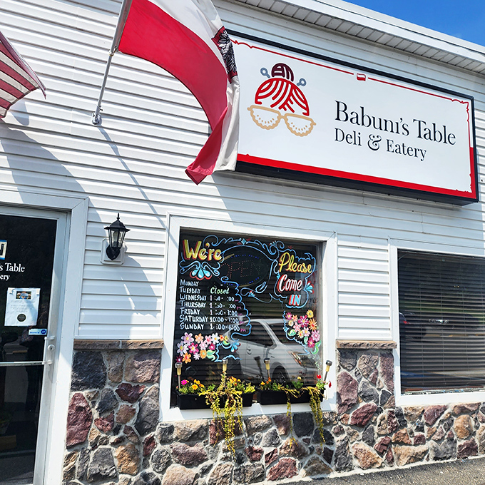 Sunshine highlights the cheerful exterior while the Polish flag waves a welcome. Your stomach's happy place awaits inside.