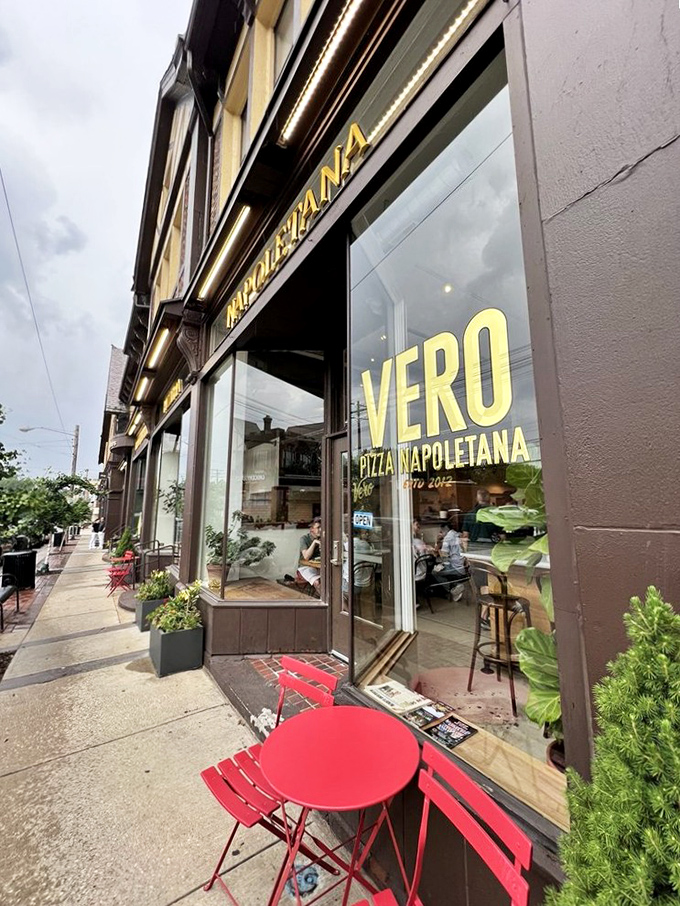 From the sidewalk, Vero's inviting storefront offers a glimpse of the Neapolitan paradise within, complete with charming red café table for outdoor dreamers.