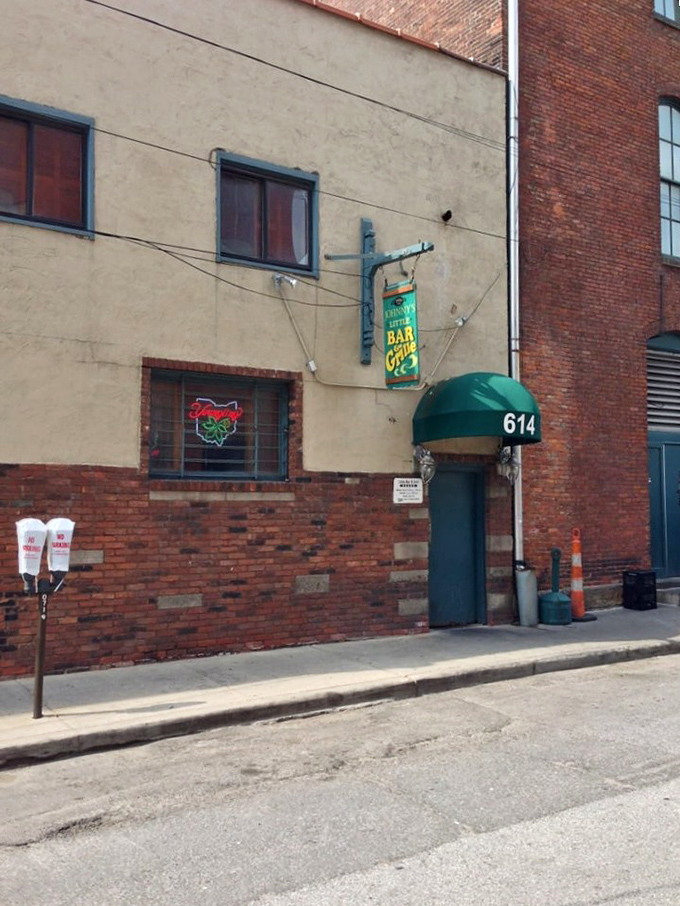 From the street, you might walk right past. But locals know—behind that green awning and modest exterior waits Cleveland's burger paradise.