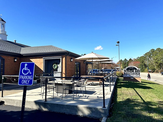 Blue skies frame the outdoor seating area &ndash; nature's perfect backdrop for the smoke-infused feast that awaits inside.