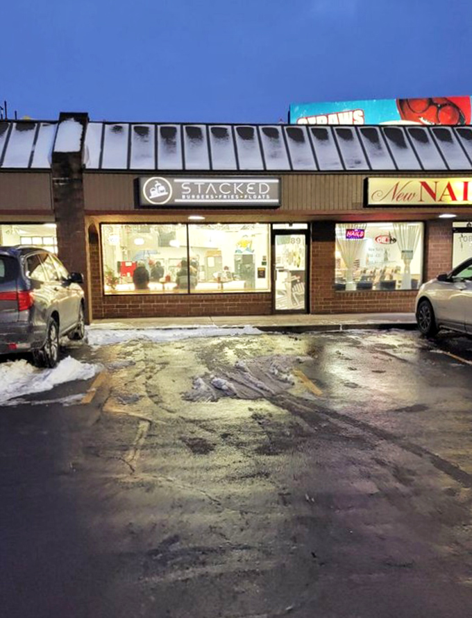 As evening falls, Stacked's warm glow beckons hungry travelers like a lighthouse guiding ships to safe harbor—if ships craved excellent burgers.