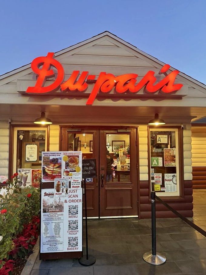 As day turns to dusk, that glowing sign becomes a beacon for the hungry, the nostalgic, and anyone who understands that pancakes taste better after dark.