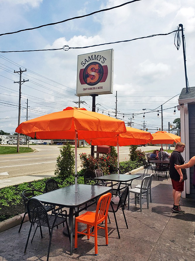 The patio where summer memories are made. Those orange umbrellas are like beacons calling road-trippers home to Sammy's.