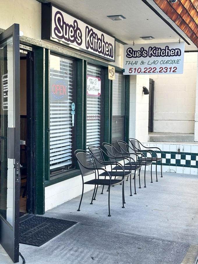 The exterior sign proudly announces "Thai & Lao Cuisine," a promise of authentic flavors that Sue's Kitchen delivers on with every dish.