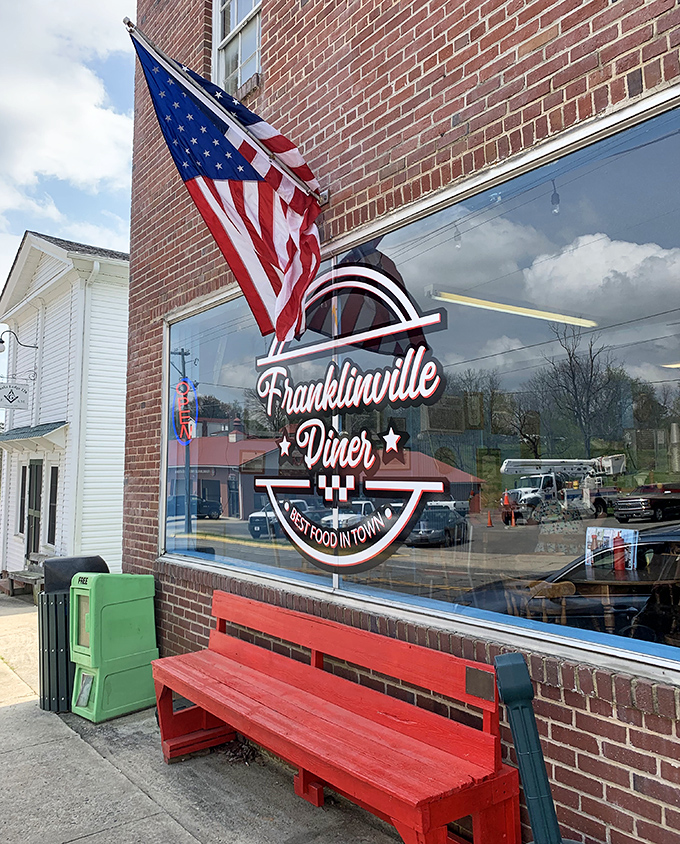 That red bench and proud American flag aren't just decorations&mdash;they're a promise that inside these brick walls, tradition still matters.