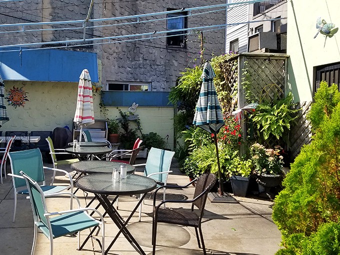 The secret garden patio offers urban oasis vibes &ndash; where your coffee comes with a side of fresh air.