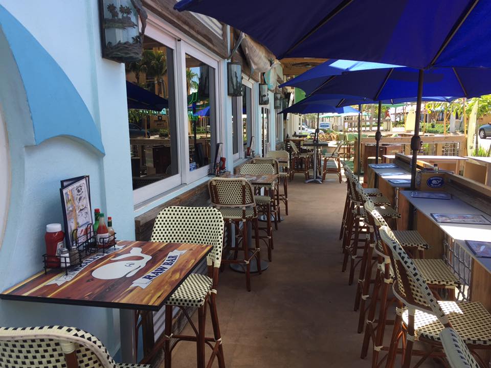 Outdoor seating that combines the best of Florida living: ocean breezes, cold drinks, and the anticipation of seafood that'll make you swoon.