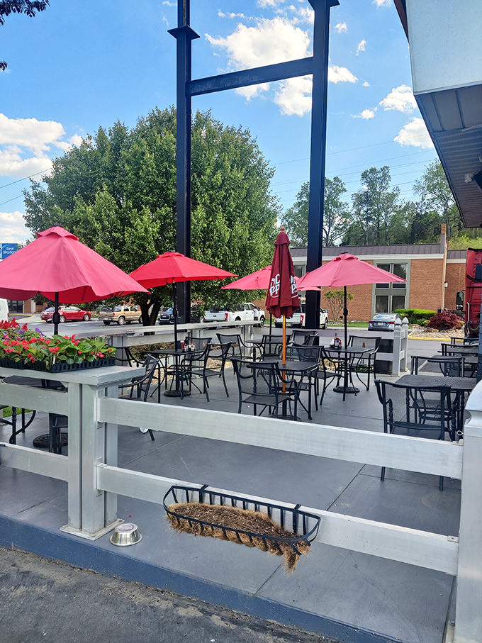 The outdoor patio with its cheerful red umbrellas offers al fresco dining where Virginia breezes complement every bite.