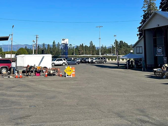 The calm before the shopping storm &ndash; early morning at the fairgrounds parking lot, where empty spaces will soon fill with vehicles carrying empty trunks ready for filling. 