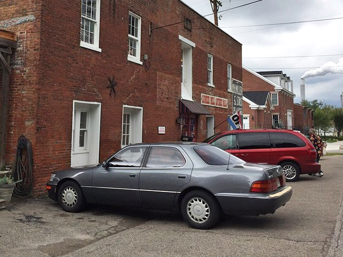 The unassuming exterior belies the wonderland within. Cars parked outside represent fellow adventurers already discovering what might become their next conversation piece.