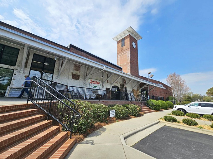 Industrial charm meets Southern hospitality at The Depot's exterior. That clock tower stands as a reminder that here, time slows down for treasure hunters.