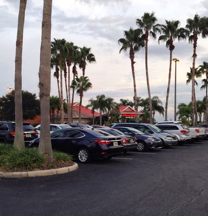 Even the parking lot feels tropical with swaying palm trees standing at attention, as if they're the first welcoming committee to your Caribbean culinary journey.