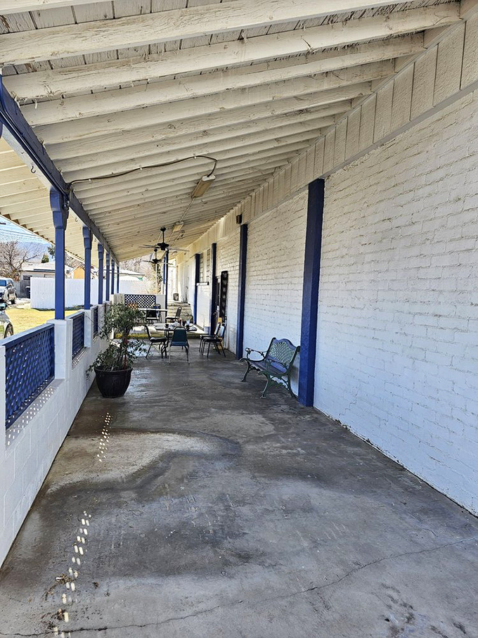 Even the patio maintains that classic blue-and-white charm, offering a peaceful spot to digest both your meal and the mountain views.