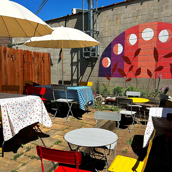 A cheerful patio adorned with colorful tables, chairs, and umbrellas. When Ohio's weather cooperates, this little urban oasis becomes the hottest seat in town.