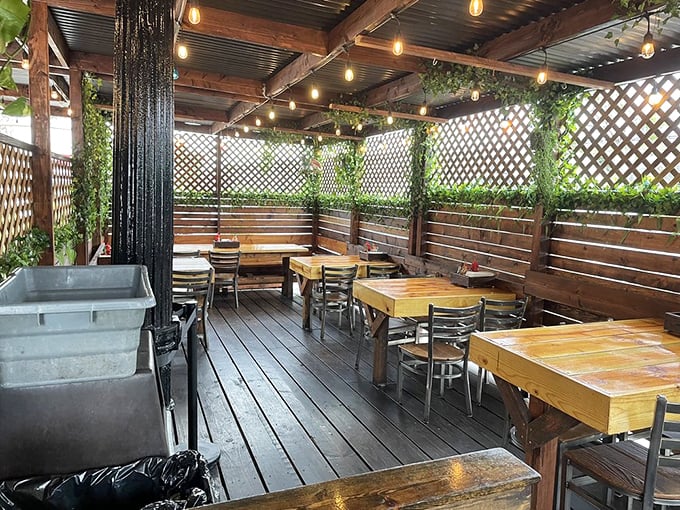 The patio offers a breath of fresh air with your fresh catch. String lights and wooden accents create that perfect "I've discovered something special" atmosphere for your seafood feast.