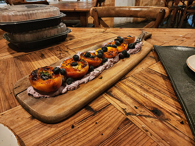 Grilled peaches that prove dessert doesn't need chocolate to be memorable. Sweet, smoky fruit with fresh berries &ndash; summer's greatest achievement on a wooden plank.