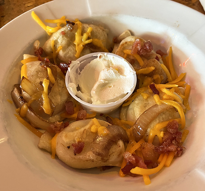 Pillowy pierogies swimming in butter with bacon bits and melted cheese&mdash;Polish grandmothers everywhere would give these their blessing.