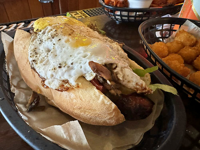 A fried egg crowns this meaty marvel like a golden sunrise over your wildest culinary dreams.