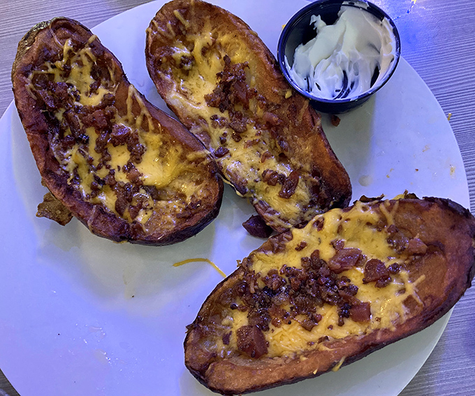 Potato skins that could convert a carb-avoider back to the starchy side. Crispy vessels loaded with cheese and bacon&mdash;the ultimate shareable indulgence.
