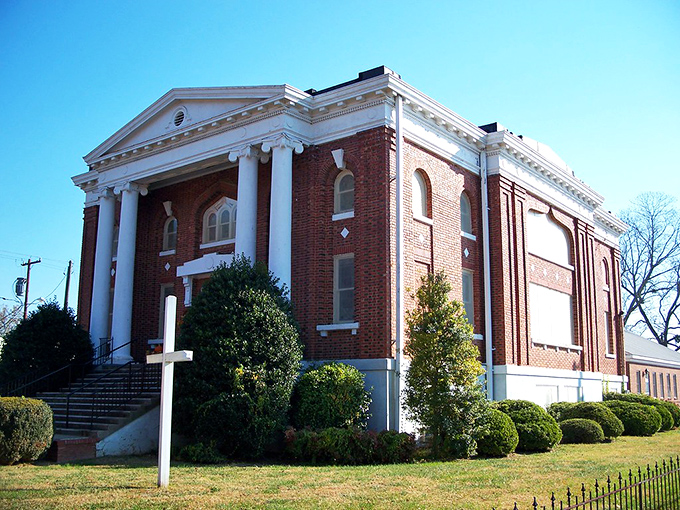 This stately brick church has witnessed countless weddings, funerals, and Sunday best outfits. Its columns reach skyward, connecting earth to heaven.