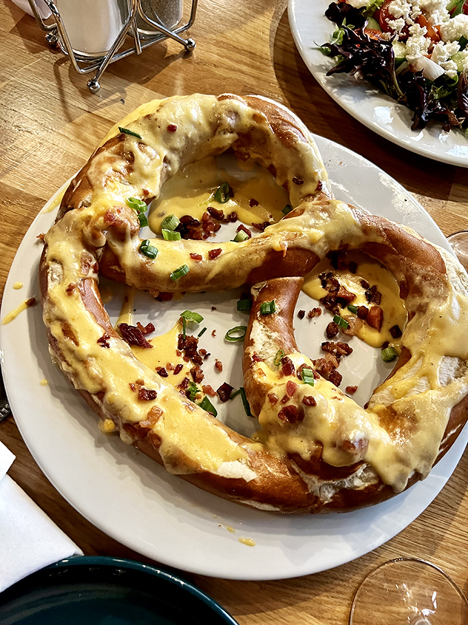 This isn't just a pretzel&mdash;it's a golden brown masterpiece topped with cheese, bacon, and possibility. Carbs have never looked so worthy of devotion.