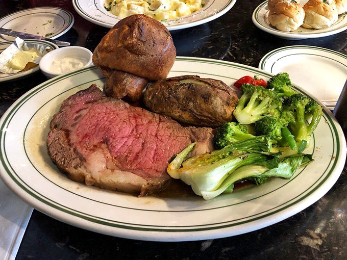 Prime rib cooked to that perfect rosy hue that meat lovers dream about. That Yorkshire pudding is the unsung hero of the plate.
