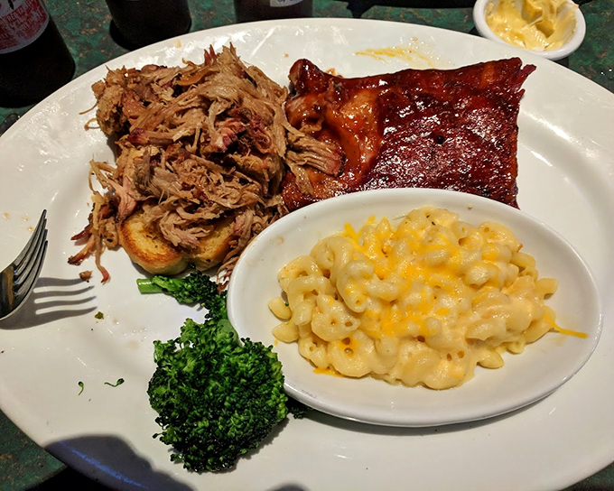 The barbecue trifecta &ndash; pulled pork, ribs, and mac and cheese on one plate &ndash; proof that sometimes the hardest life decisions are which meat to eat first.