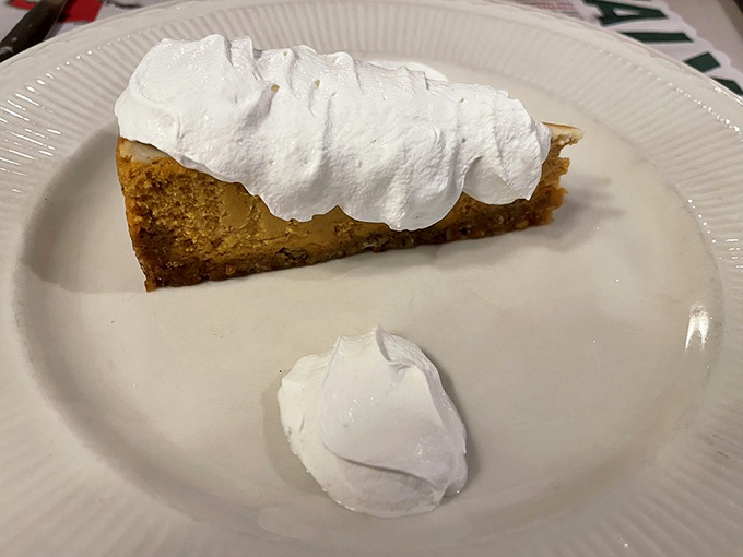 Pumpkin cheesecake crowned with whipped cream—where Italian dessert tradition meets American autumn in a fork-ready slice of heaven.