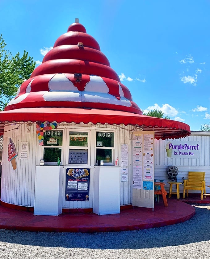 The Purple Parrot's swirly red roof signals the universal truth that ice cream tastes better when consumed from a building that looks like dessert itself.