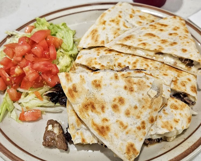 This quesadilla isn't messing around—packed with steak and melted cheese, it's the lunch option that makes breakfast-only folks question their life choices.