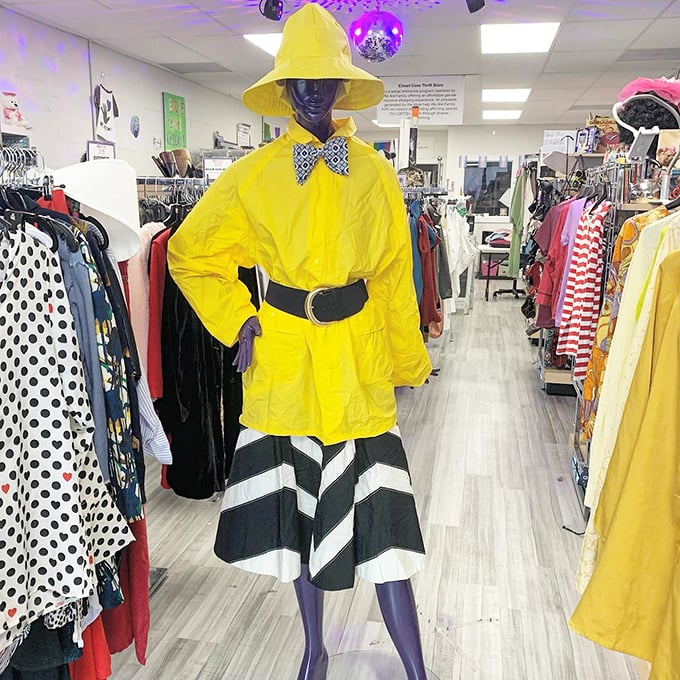 The mannequin's bold yellow ensemble makes rainy days look downright cheerful. Who needs designer labels when you can rock this much personality?