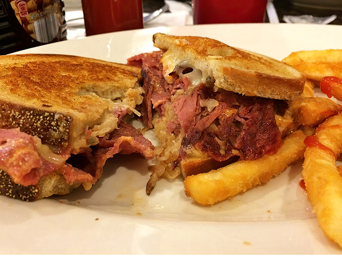 A proper Reuben doesn't hide its ambitions—it flaunts them with melted Swiss, perfectly grilled rye, and corned beef that's ready for its close-up.