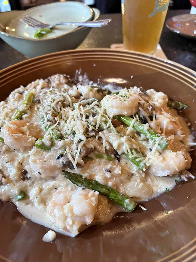 Creamy risotto studded with plump shrimp and tender asparagus&mdash;proof that comfort food can wear fancy clothes when it wants to impress.
