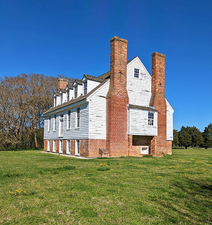 Colonial architecture at its finest with twin chimneys reaching skyward. This historic River House has weathered centuries with the dignified grace of a Southern gentleman.