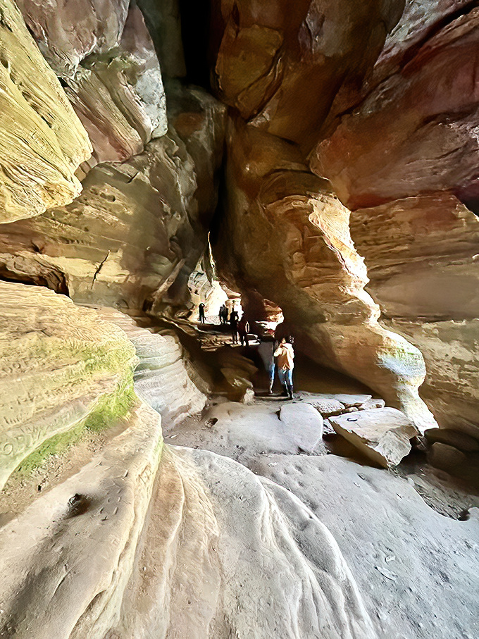 Sunlight illuminates the otherworldly interior of Rock House. These stone hallways have witnessed centuries of visitors, each leaving only footprints.
