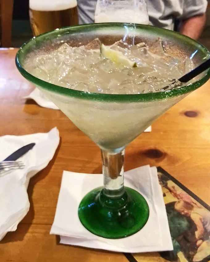 Rum runner cocktail that transports you to island time without requiring passport or sunscreen application.