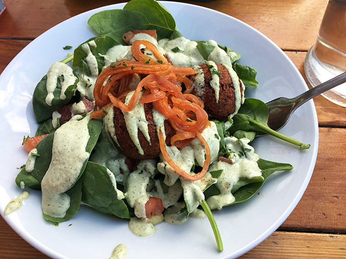 A salad that refuses to be a supporting character. Those vibrant greens and that creamy dressing are staging a delicious revolution on your plate.