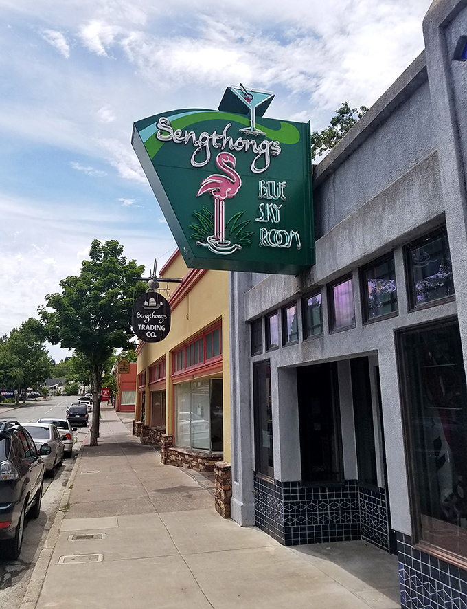 Sengthong's Blue Sky Room sign promises tropical cocktails in the shadow of Mount Shasta. Tiki dreams meet mountain magic in unexpected harmony.