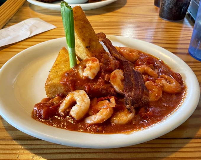 Shrimp and grits with cornbread: the dish that makes you understand why Southerners talk about food with religious reverence.