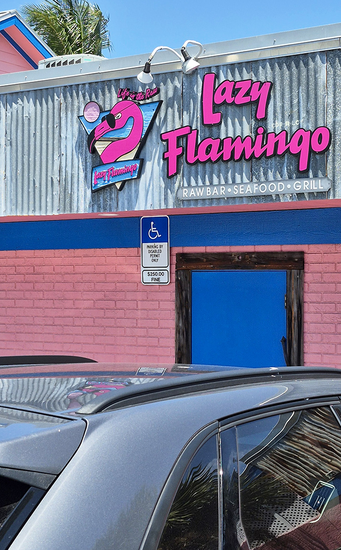 Pink walls and blue doors&mdash;the Lazy Flamingo wears Florida's colors with pride. This entrance has welcomed seafood lovers for generations.