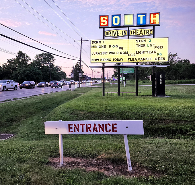 The iconic South Drive-in sign announces tonight's features, a beacon of nostalgia visible from the highway and through time.