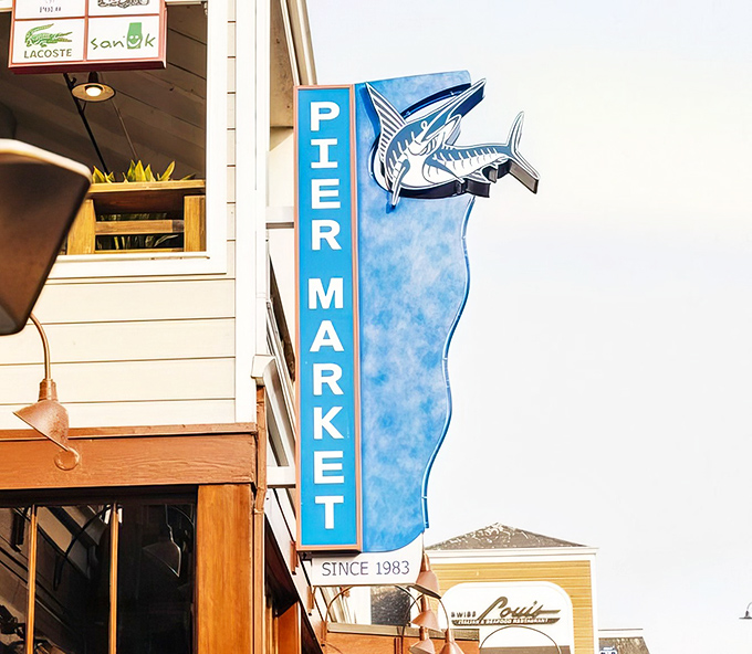 The iconic blue sign has guided hungry seafood pilgrims since 1983, like a maritime lighthouse for empty stomachs.