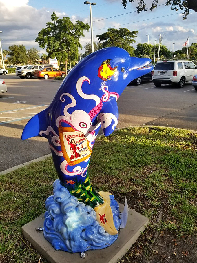 A whimsical dolphin sculpture announces your arrival at seafood paradise with the subtlety of a cartoon character&mdash;and the charm to match.