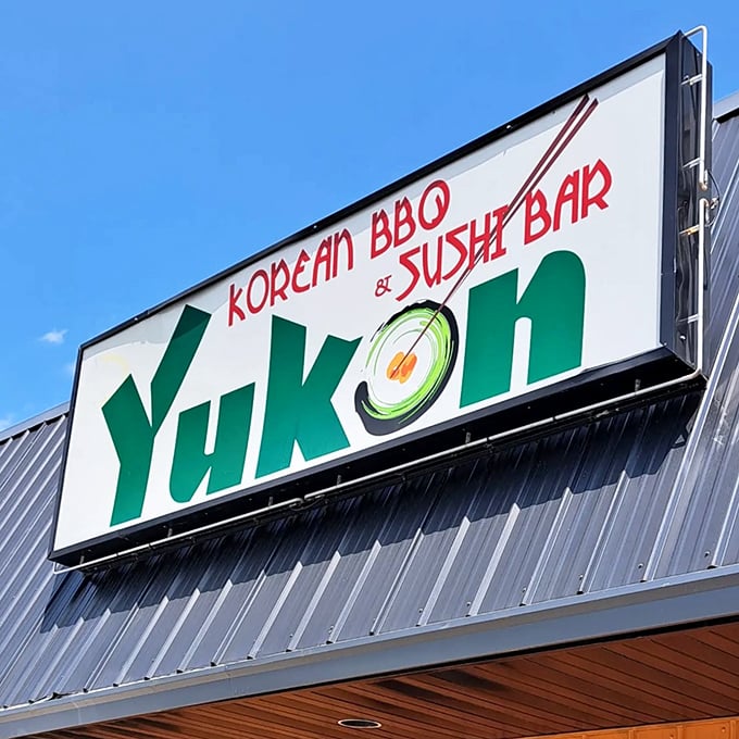 The bold signage against a blue sky &ndash; a beacon for hungry travelers and locals alike, promising culinary adventures under one roof.