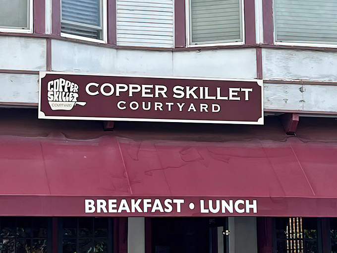The sign promises two essential meals done right. No fancy font needed when your French toast speaks volumes about your priorities.