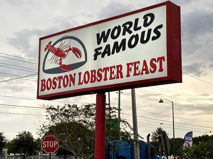 The roadside sign promises exactly what awaits inside – a world-famous feast that lives up to its bold declaration.